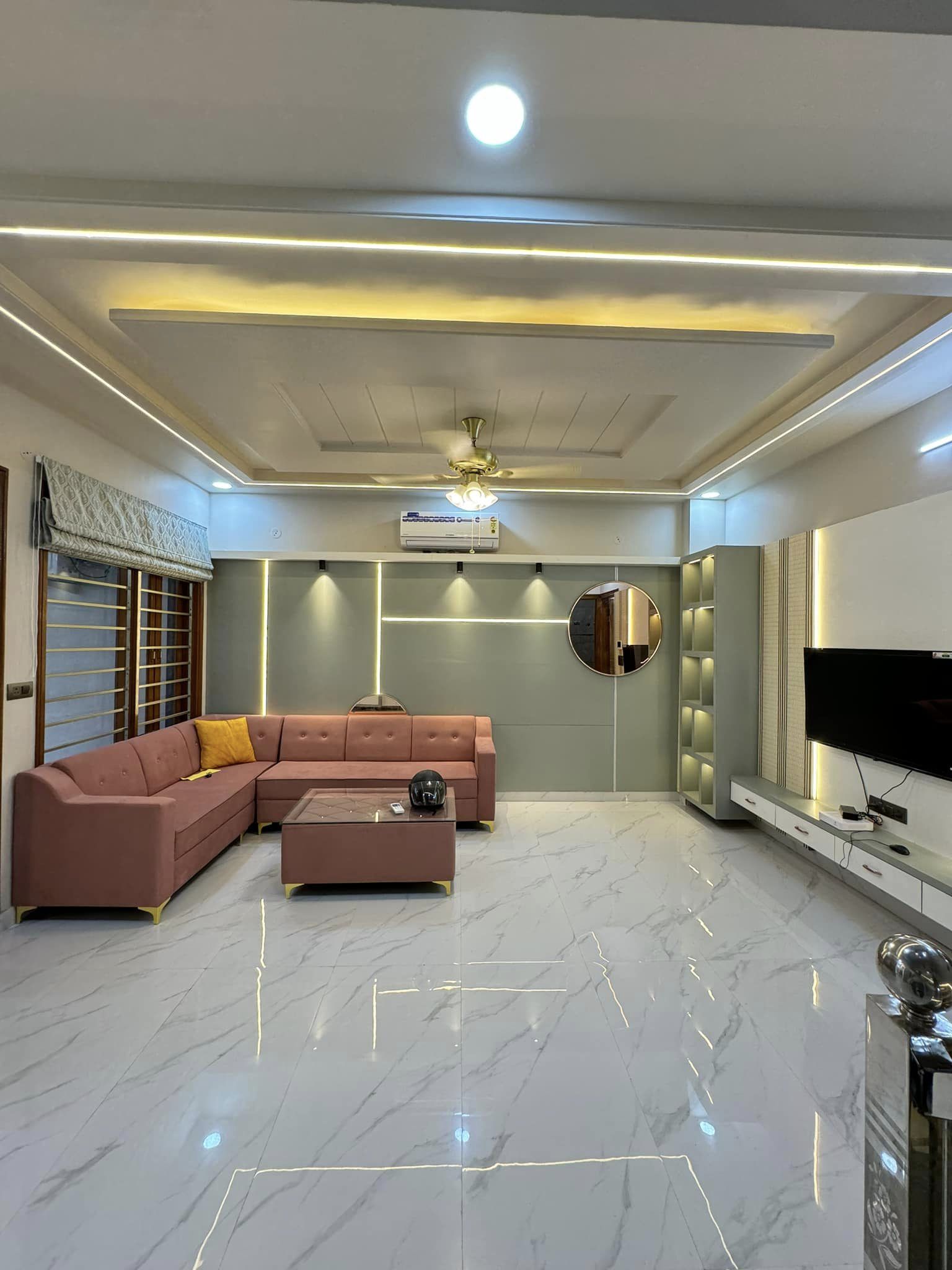 Modern Living Room Design in Gurugram With Wall of Fame